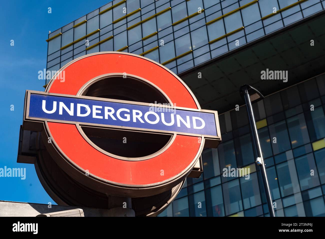 Iconic British Underground Tube Sign against modern office building in ...