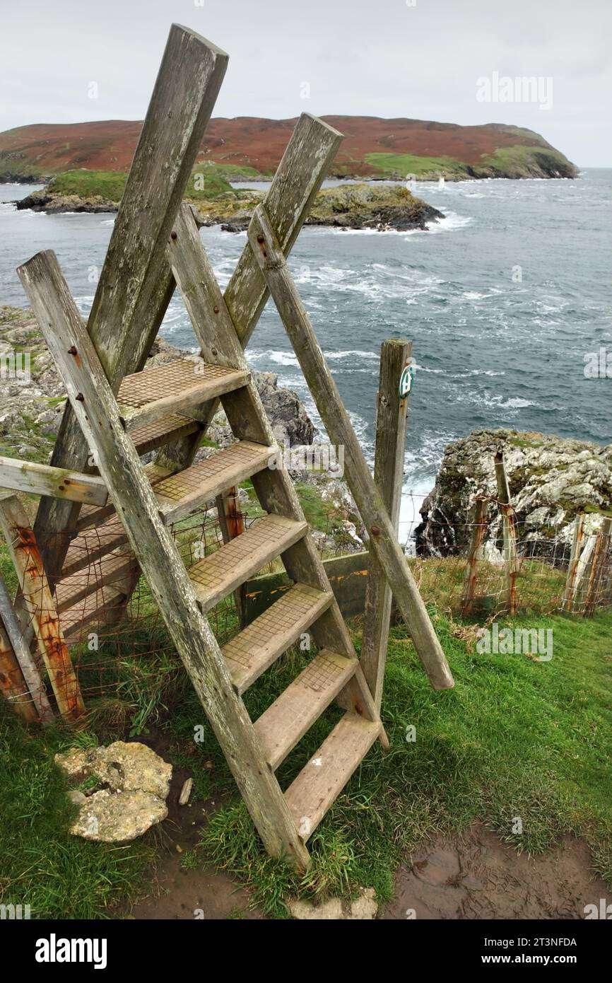 Wooden ladder stile for public footpath overlooking the Calf Sound and ...