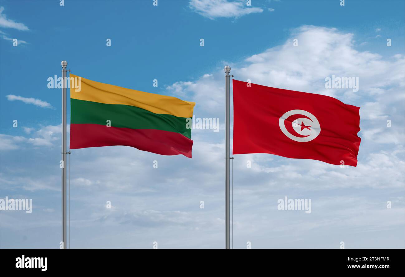 Tunisia and Lithuania flags waving together in the wind on blue cloudy sky, two country ...