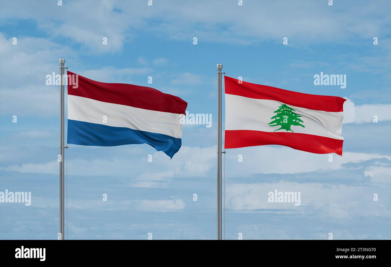 Lebanon and Luxembourg flags waving together in the wind on blue cloudy ...