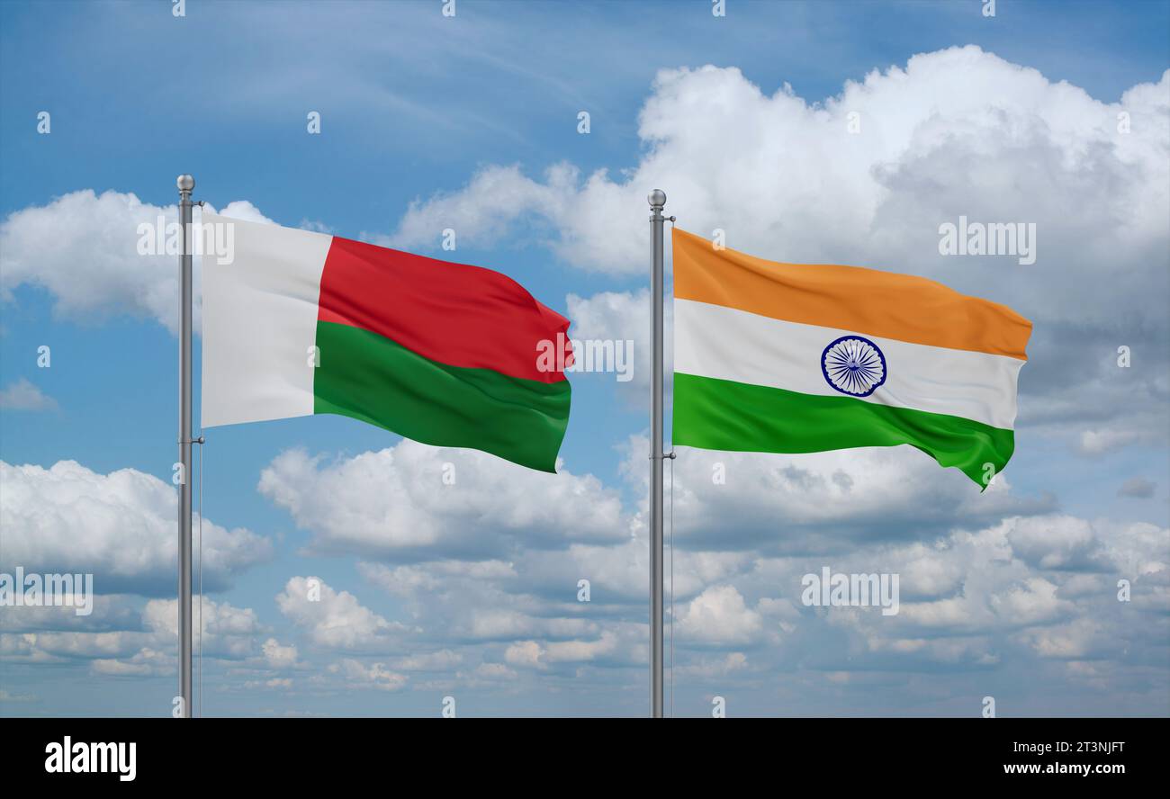 India and Madagascar flags waving together on blue cloudy sky, two ...