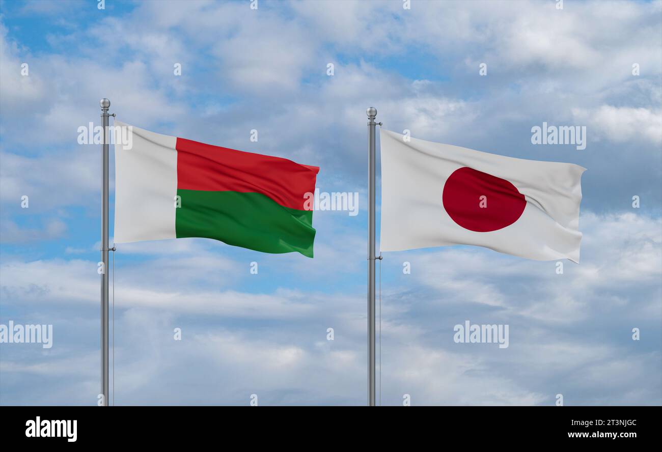 Japan and Madagascar flags waving together on blue cloudy sky, two ...