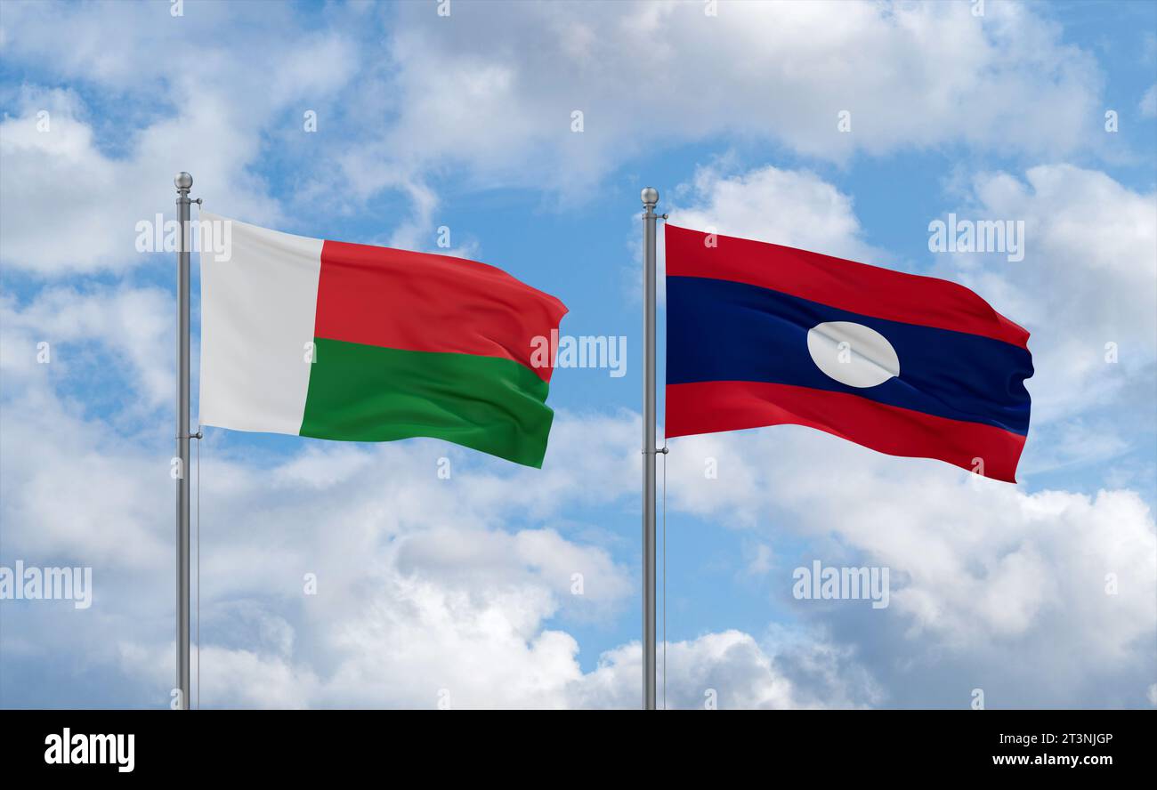 Laos and Madagascar flags waving together on blue cloudy sky, two country relationship concept ...
