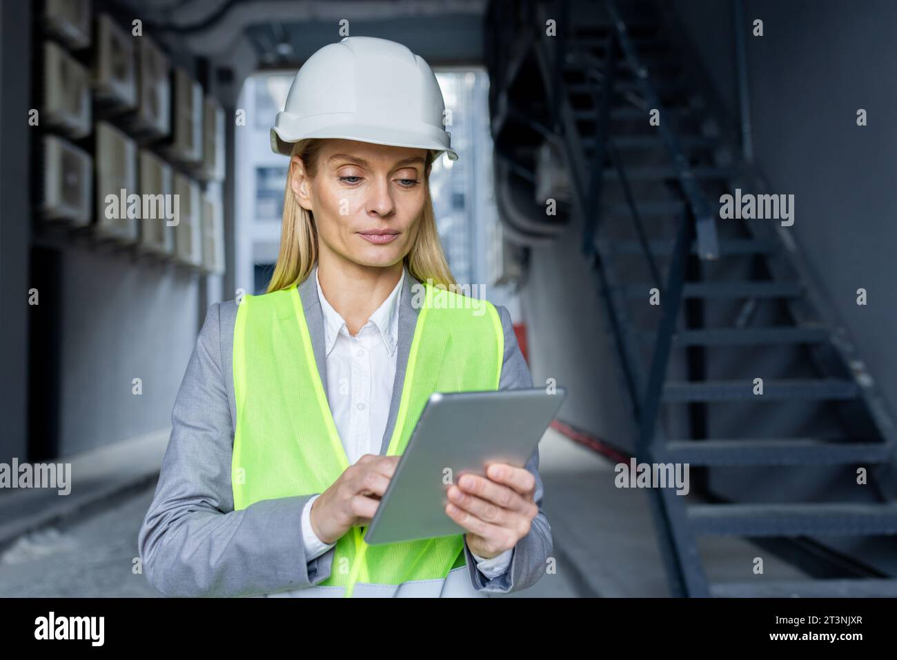 Beautiful female engineer wearing helmet hi-res stock photography and ...