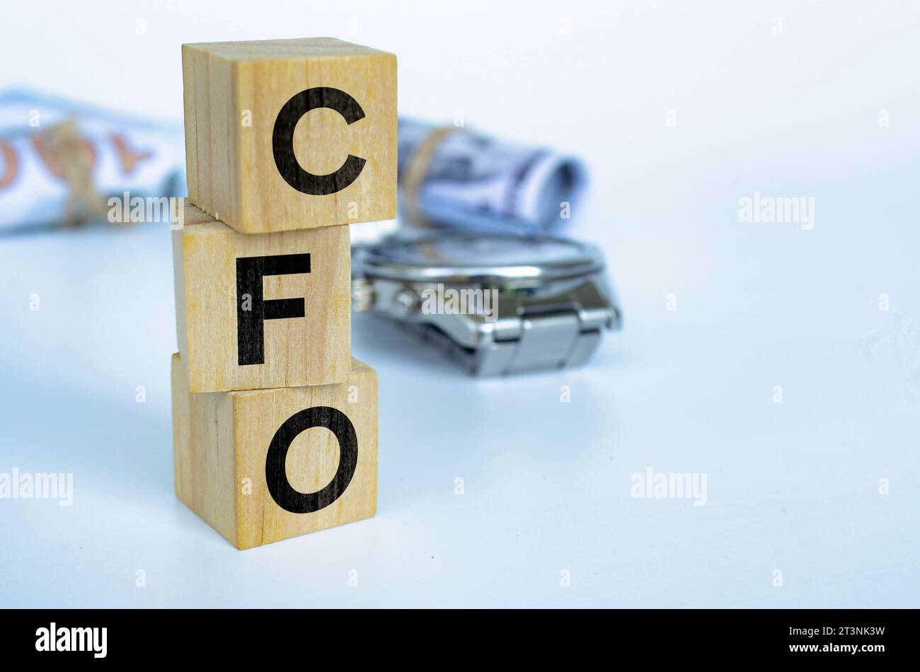 CFO text on wooden cubes representing Chief Financial Officer with ...