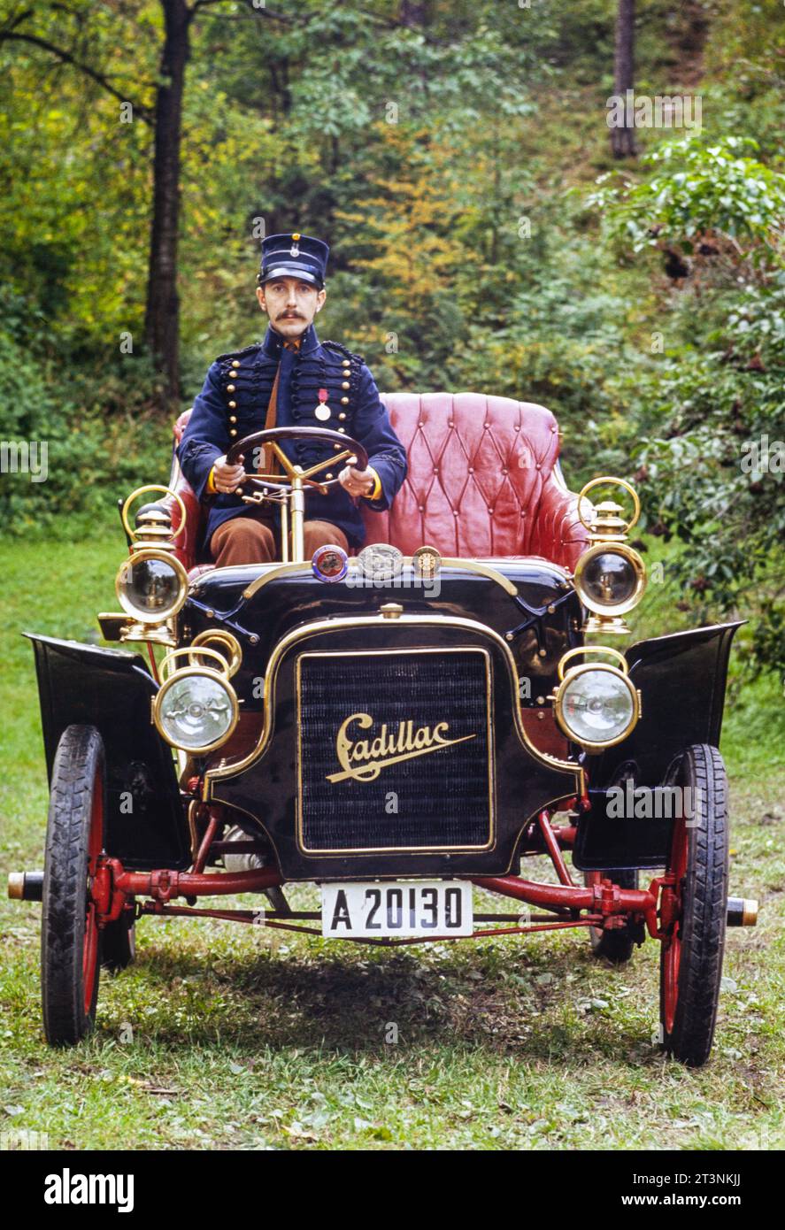 an old open Cadillac with a uniformed driver. photo: Bo Arrhed Stock ...