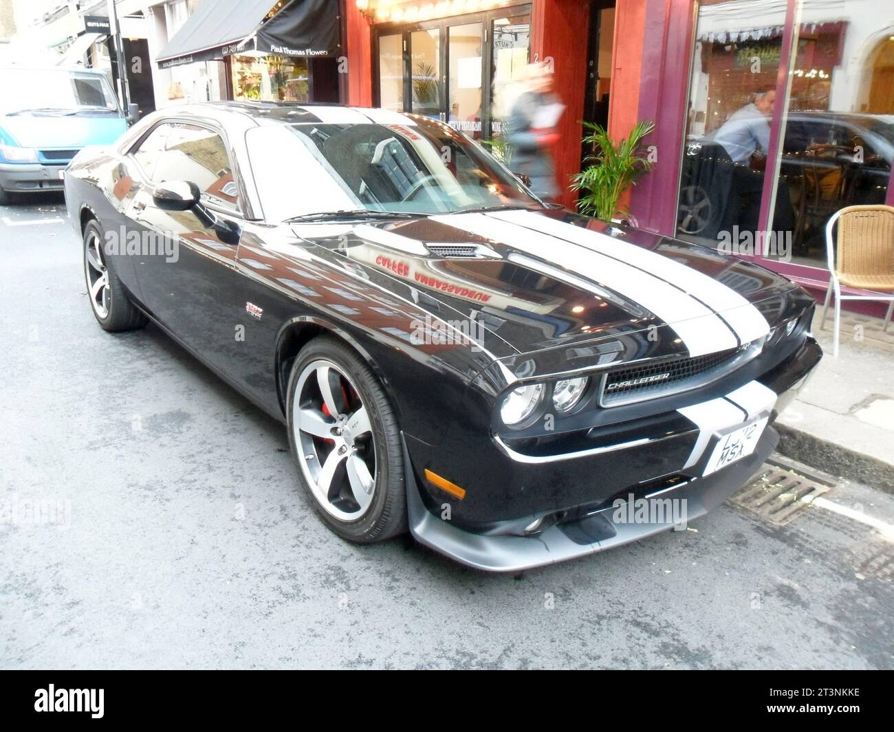 Street view of a Dodge Challenger muscle car with a motion-blurred ...