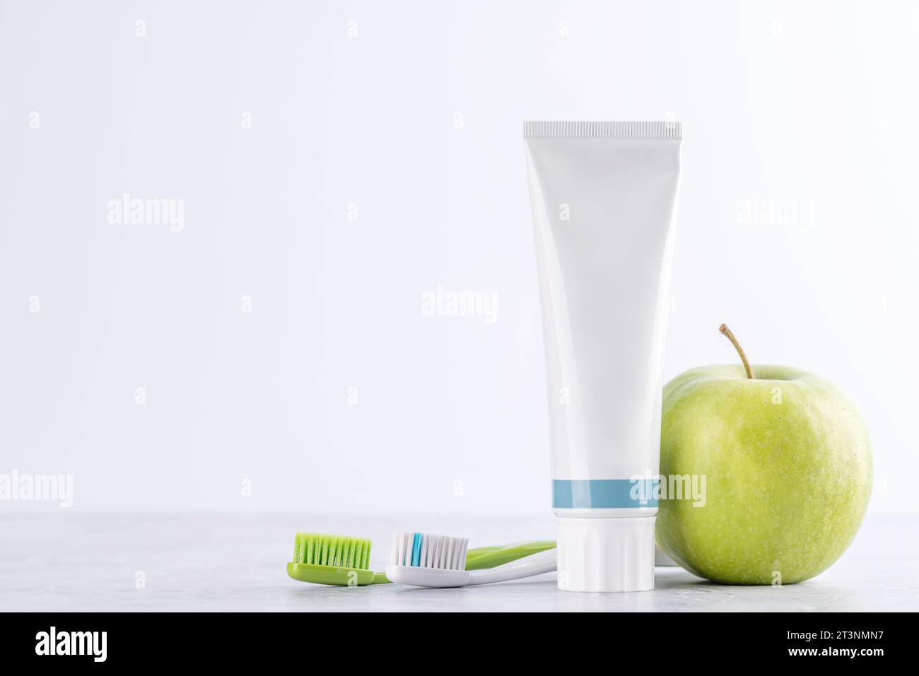 A clean and refreshing image featuring toothpaste and toothbrushes ...