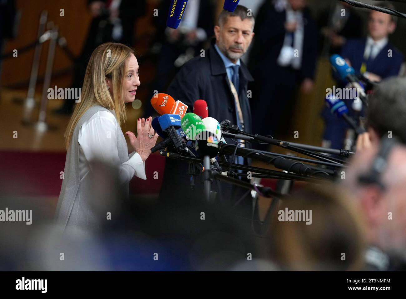Italy's Prime Minister Giorgia Meloni speaks with the media as she ...