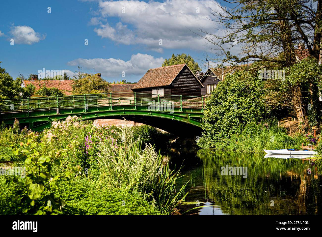 A country scene in Bures, Suffolk, England with an ancient bridge ...