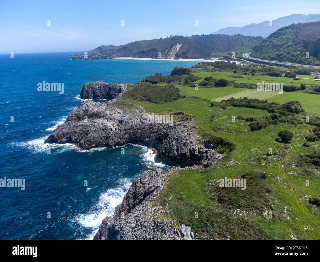 View on rocks on Playa de Toro in Llanes, Green coast of Asturias ...