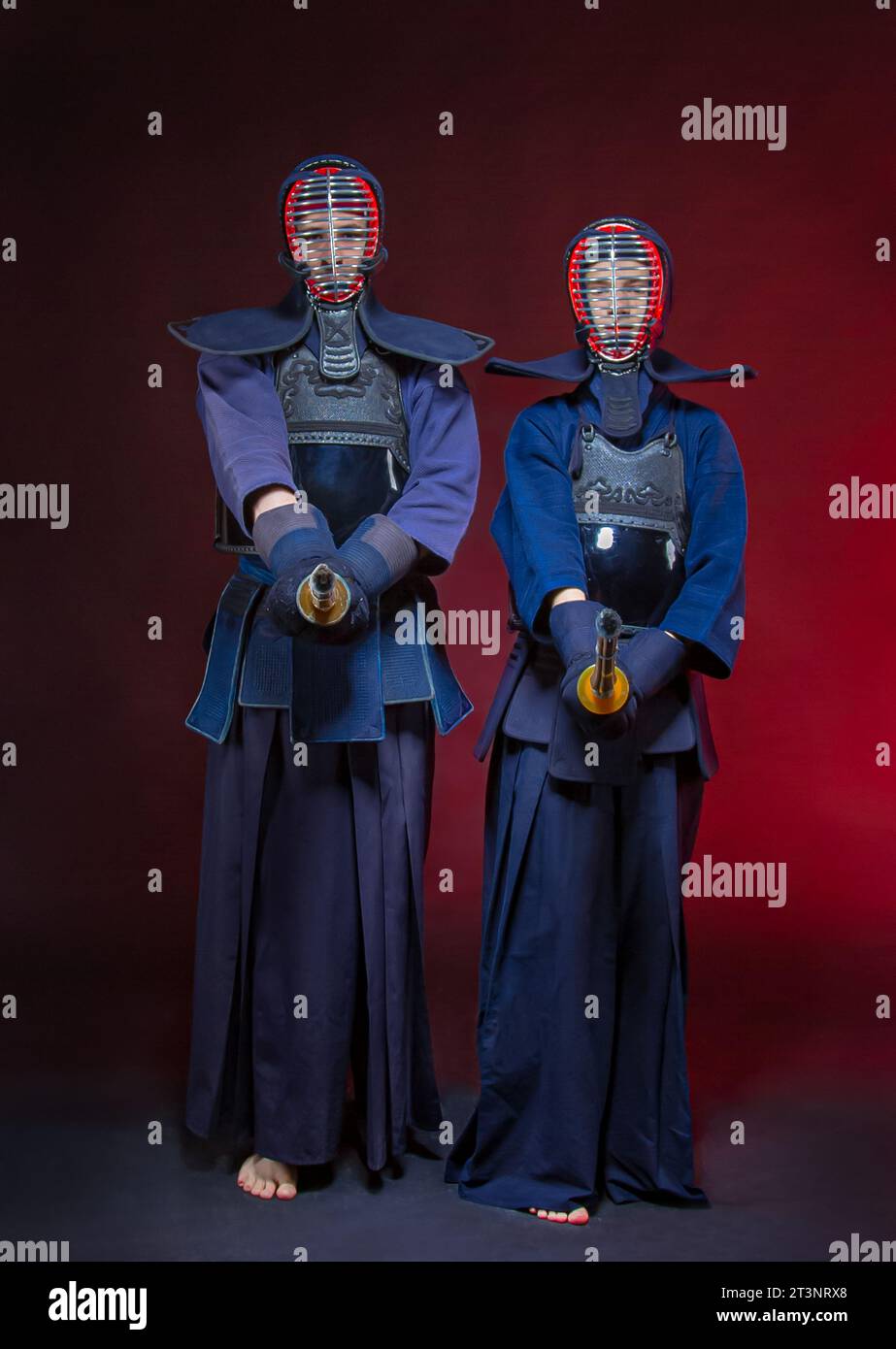 Two kendo fighters with Sinai isolated over dark space. The Japanese ...