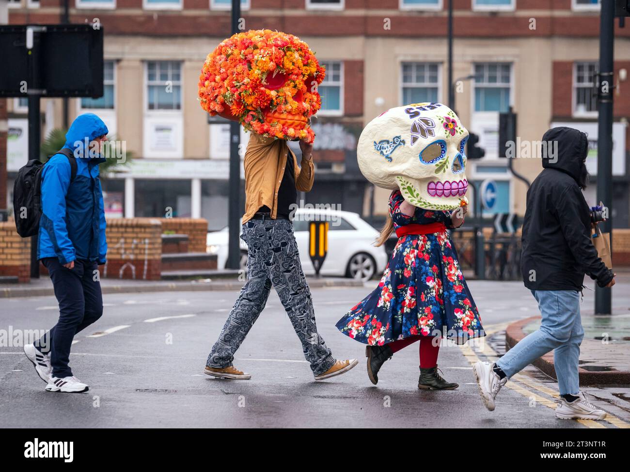Skeleton heads are carried through Leeds city centre during a photocall ...
