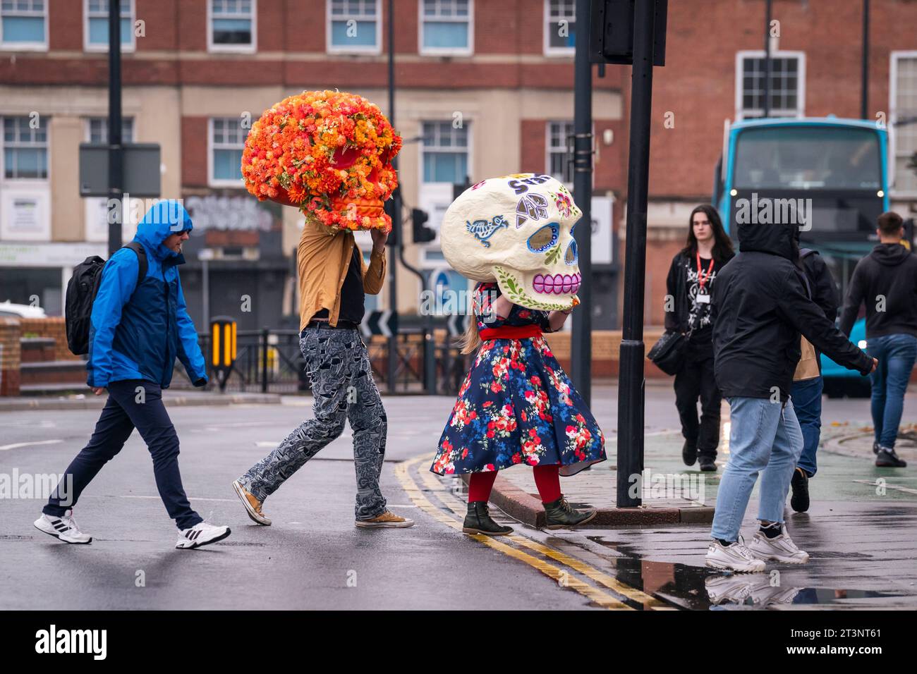 Skeleton heads are carried through Leeds city centre during a photocall ...