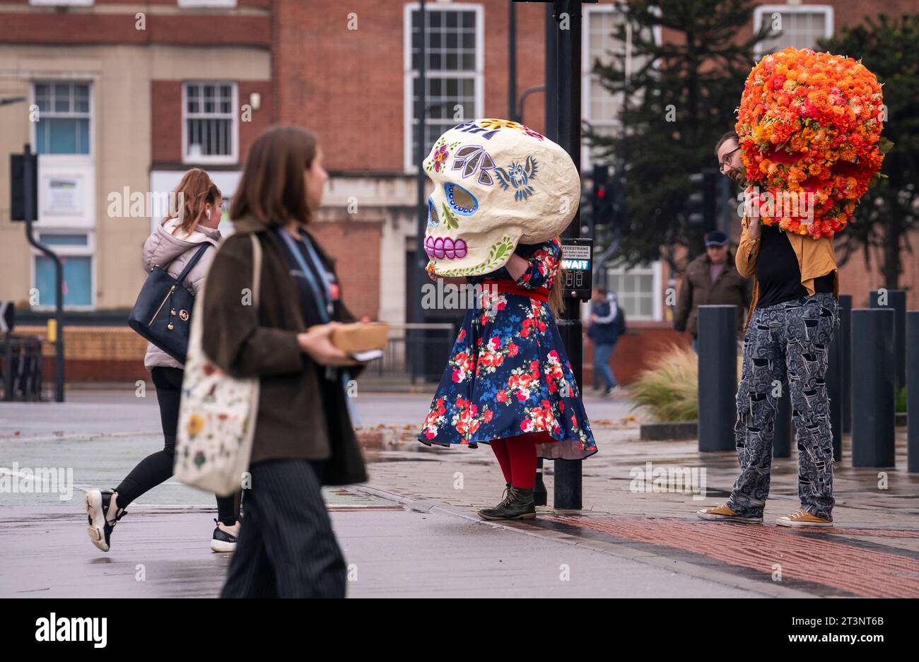 Skeleton heads are carried through Leeds city centre during a photocall ...
