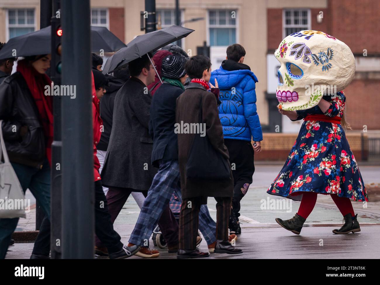 A skeleton head is carried through Leeds city centre during a photocall ...