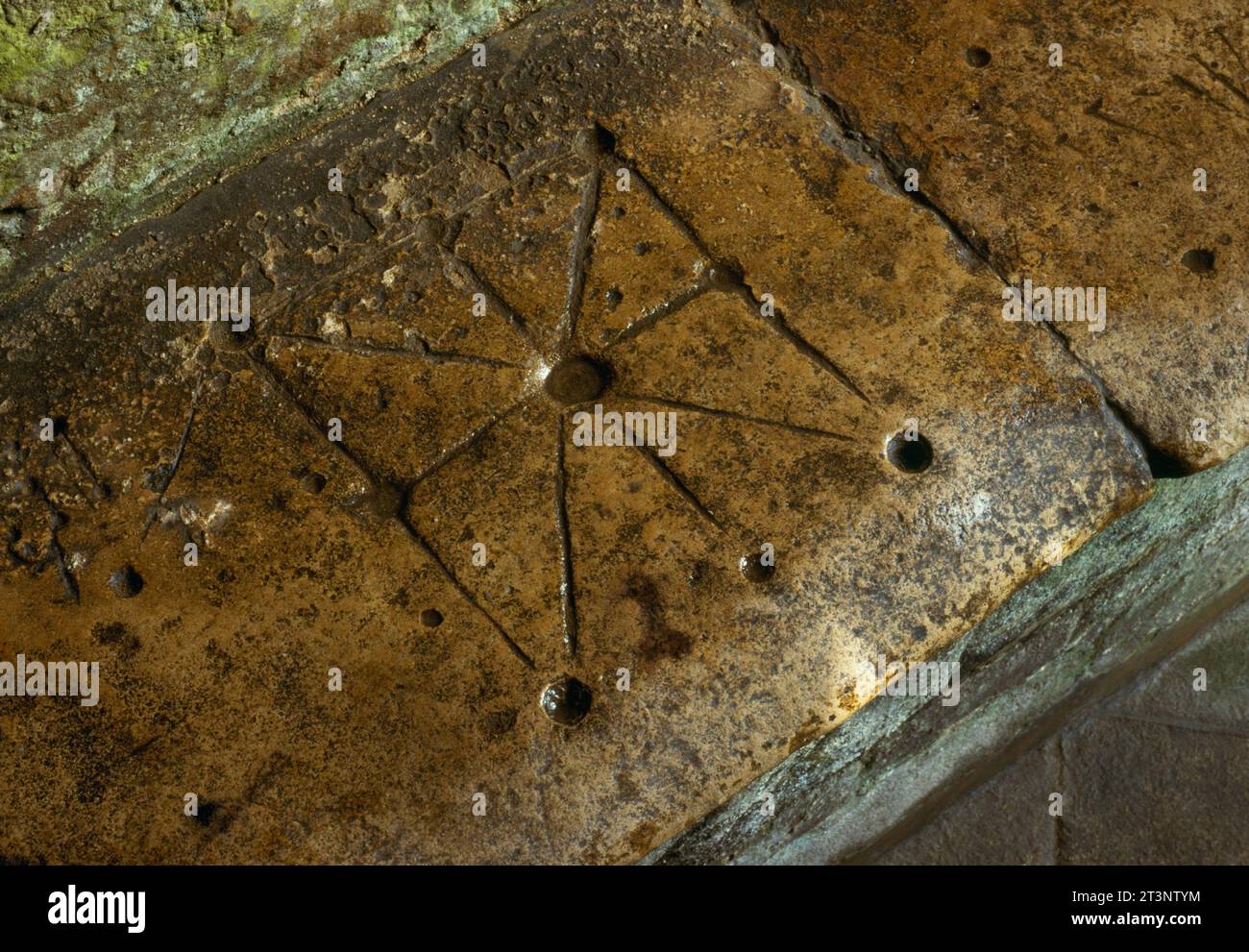 A game board (three men's morris?) carved on the E stone bench inside ...