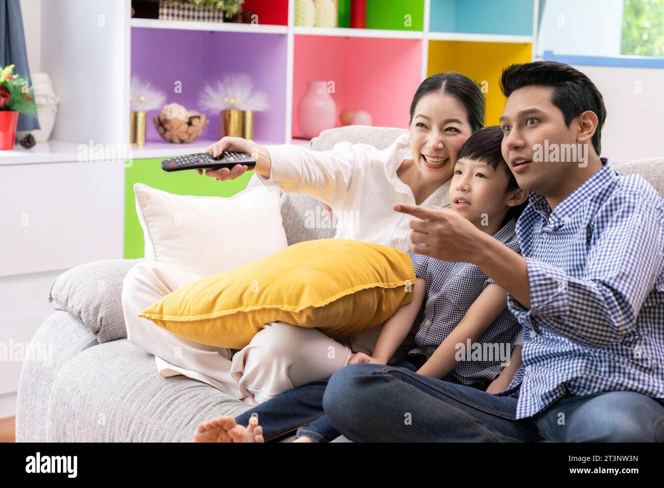 happy family watching TV together at home Stock Photo - Alamy