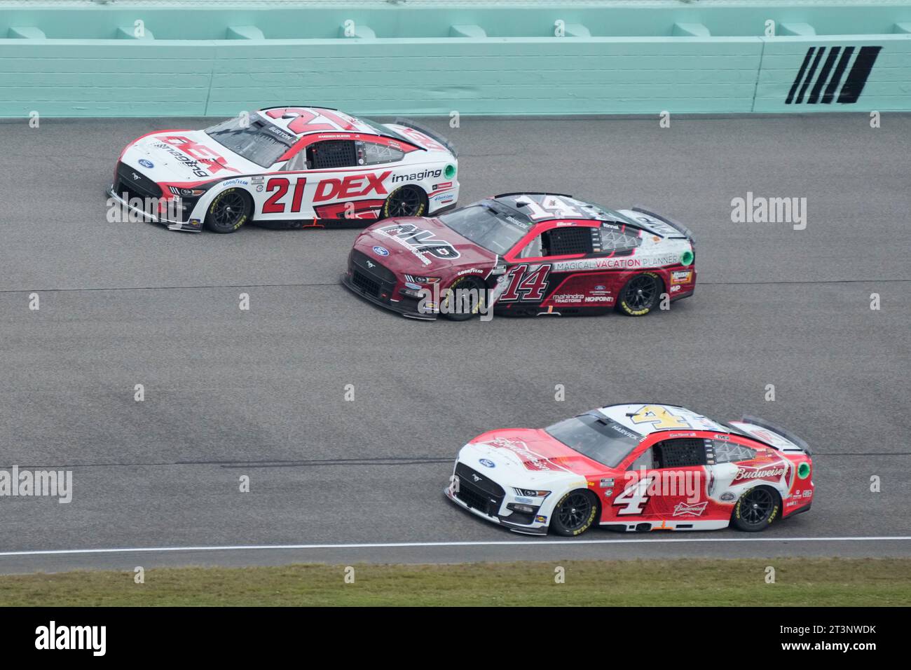 Harrison Burton (21) Chase Briscoe (14) and Kevin Harvick (4) battle ...