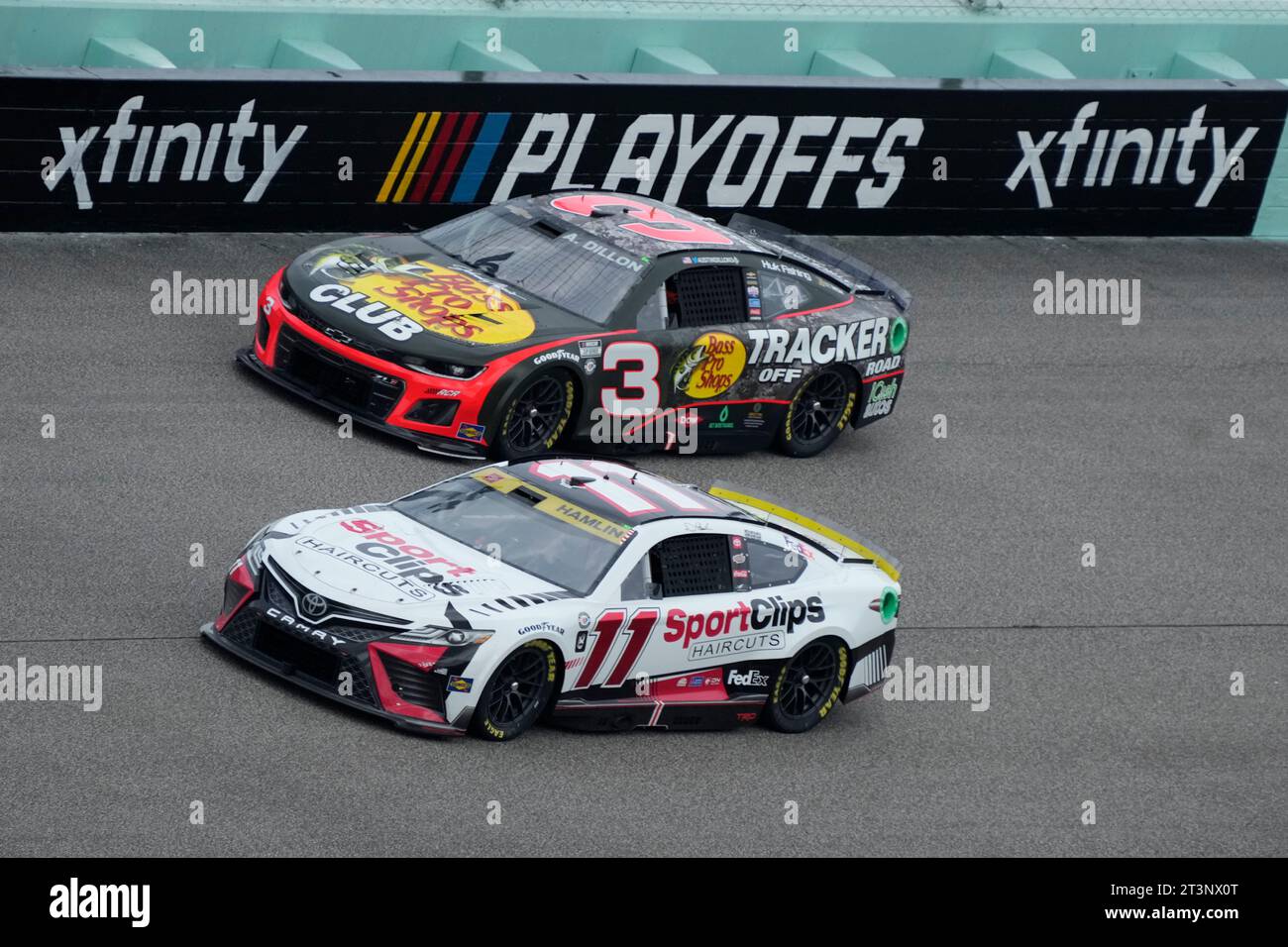 Austin Dillon (3) and Denny Hamlin (11) battle for position during the ...