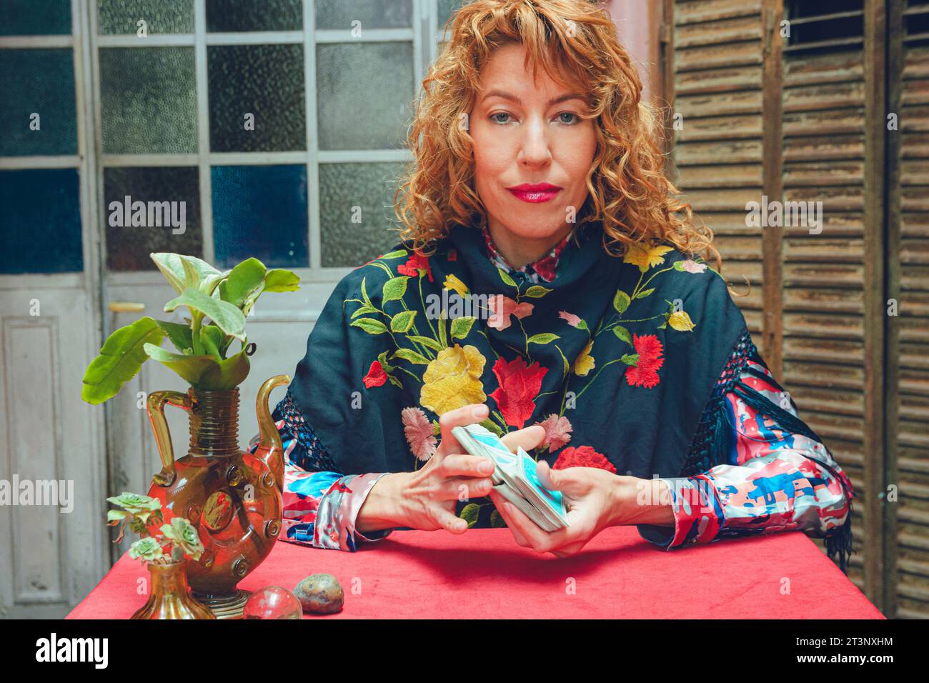 Front view of elegant Latin tarot reader woman with curls and blonde ...