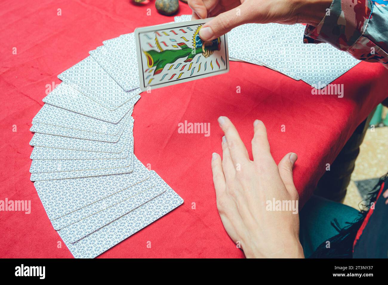 top view of unrecognizable caucasian tarot reader woman, sitting ...