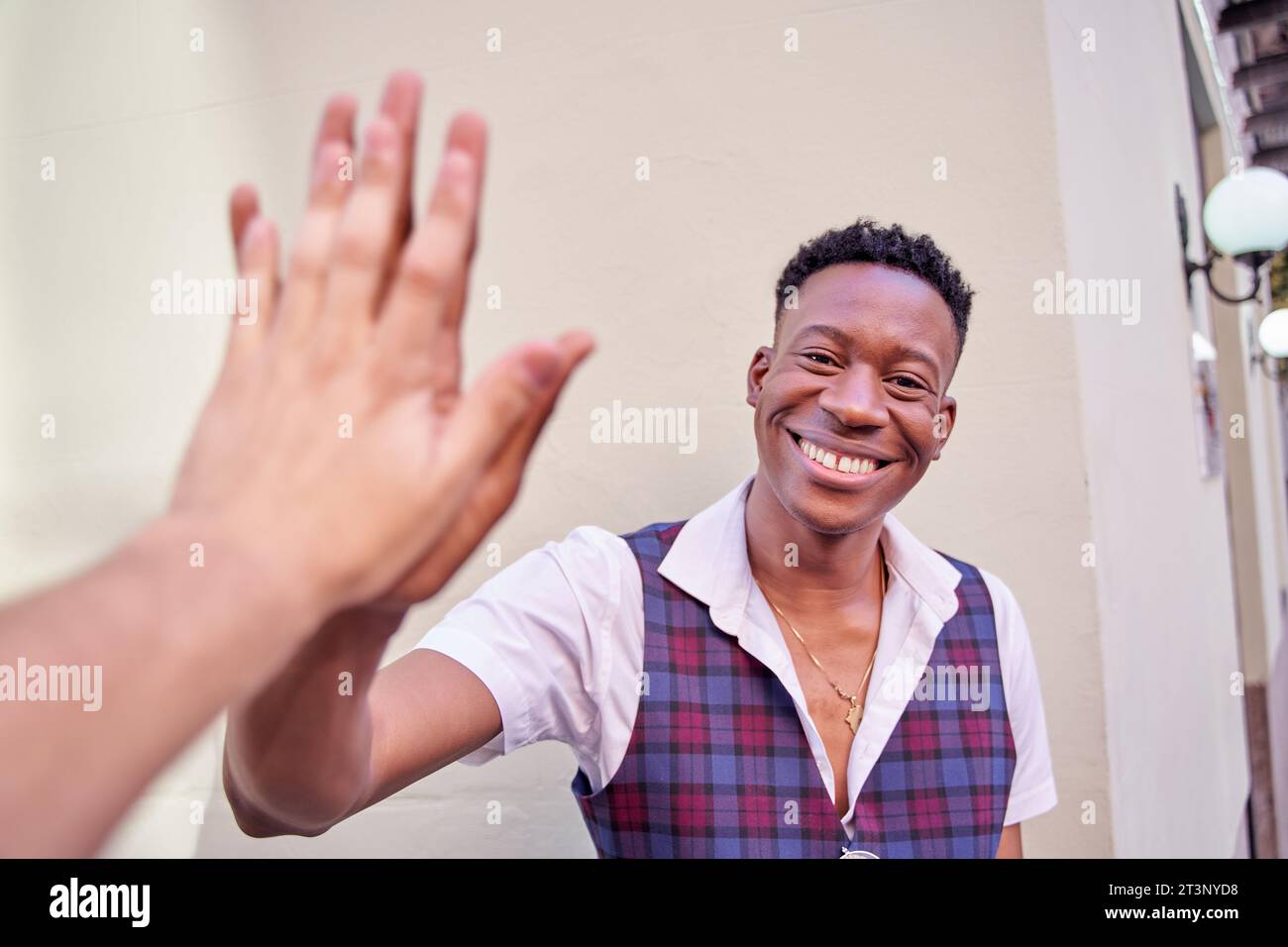 Man high five on cameraman Stock Photo - Alamy