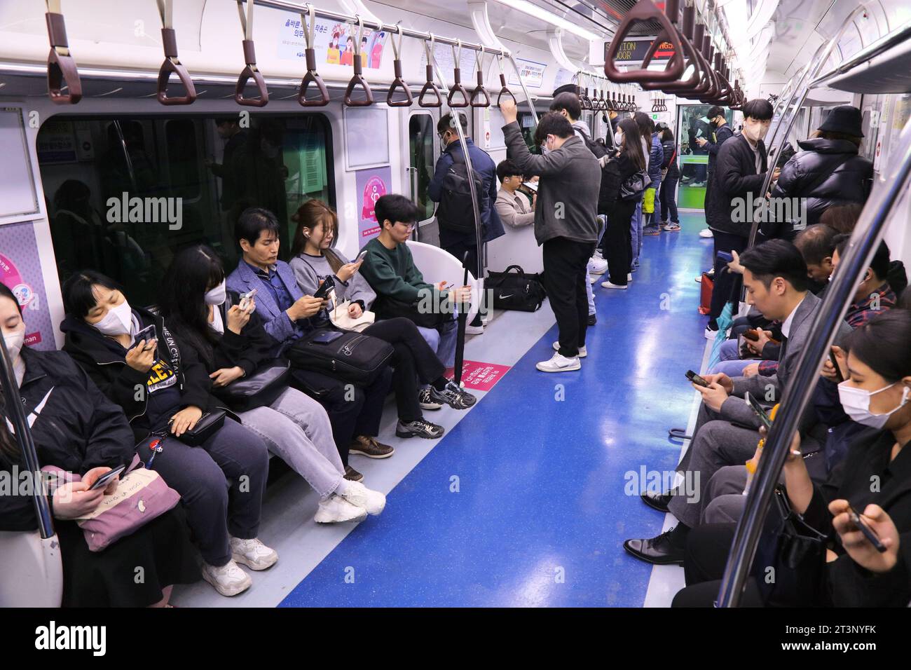 SEOUL, SOUTH KOREA - APRIL 5, 2023: Passengers ride a metro train in ...