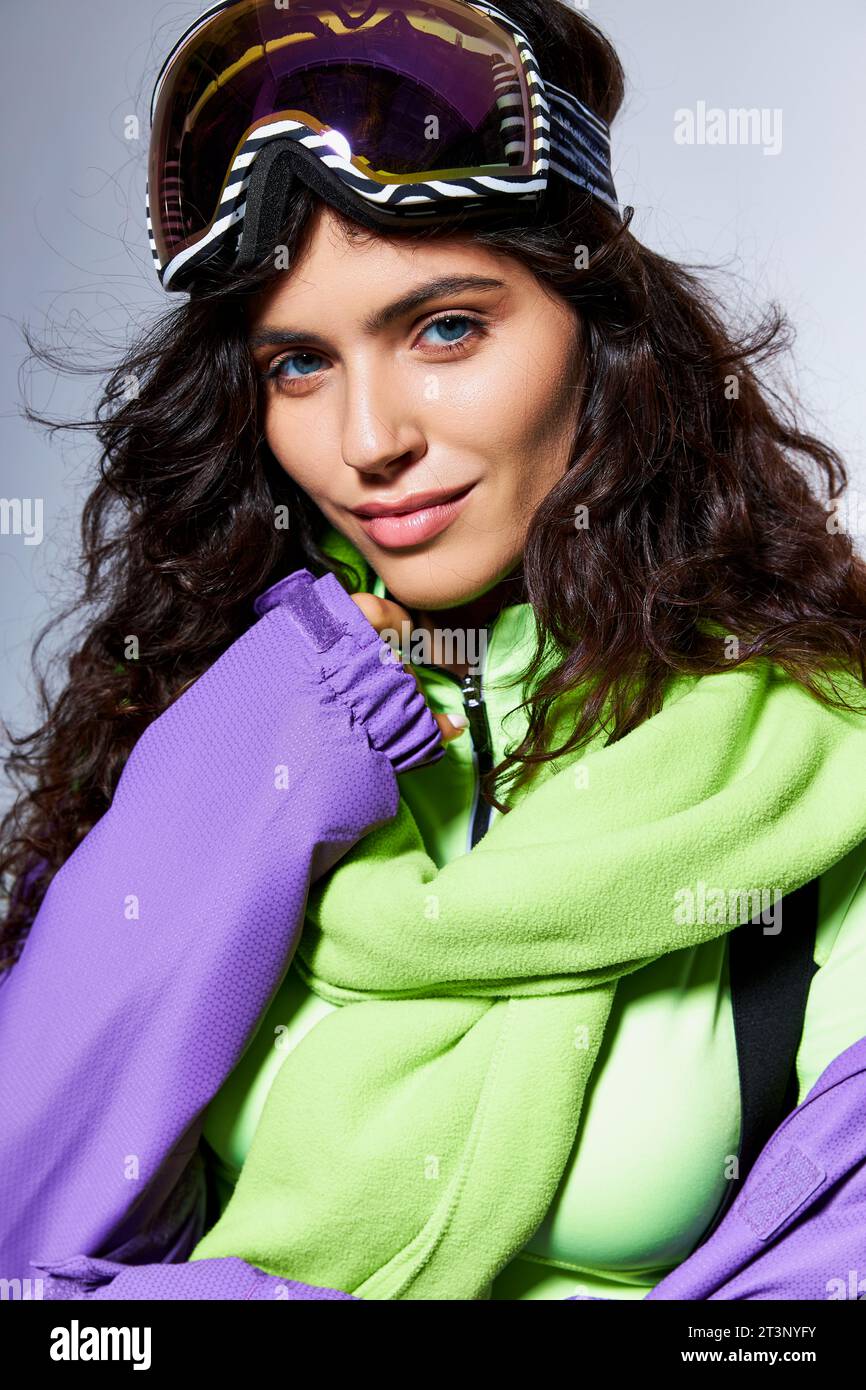 winter beauty, pretty woman with brunette hair posing in active wear ...