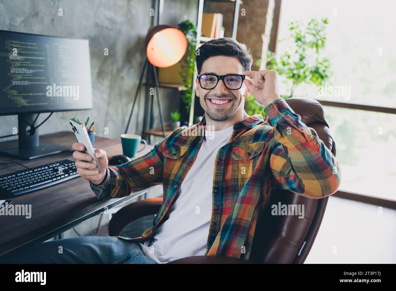 Portrait of cheerful businessman geek enjoying touching new anti glare ...