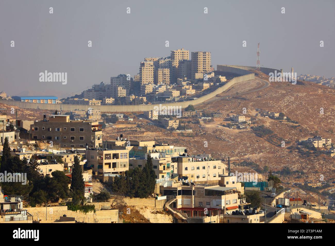 West Bank barrier concrete wall seen in background. Silwan in East ...