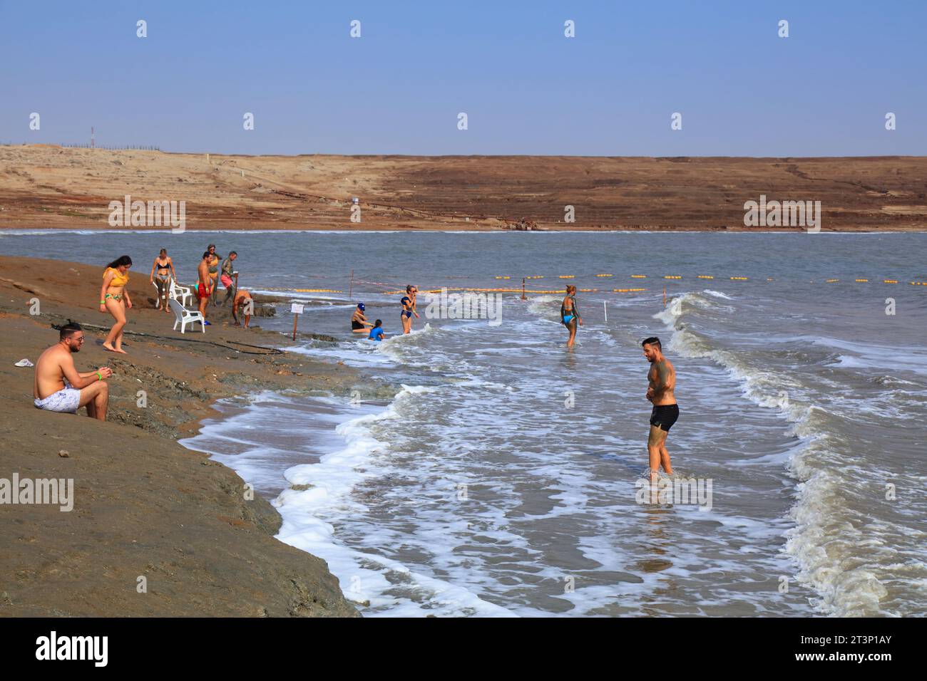 DEAD SEA, ISRAEL - OCTOBER 30, 2022: Tourists visit Dead Sea beach in ...