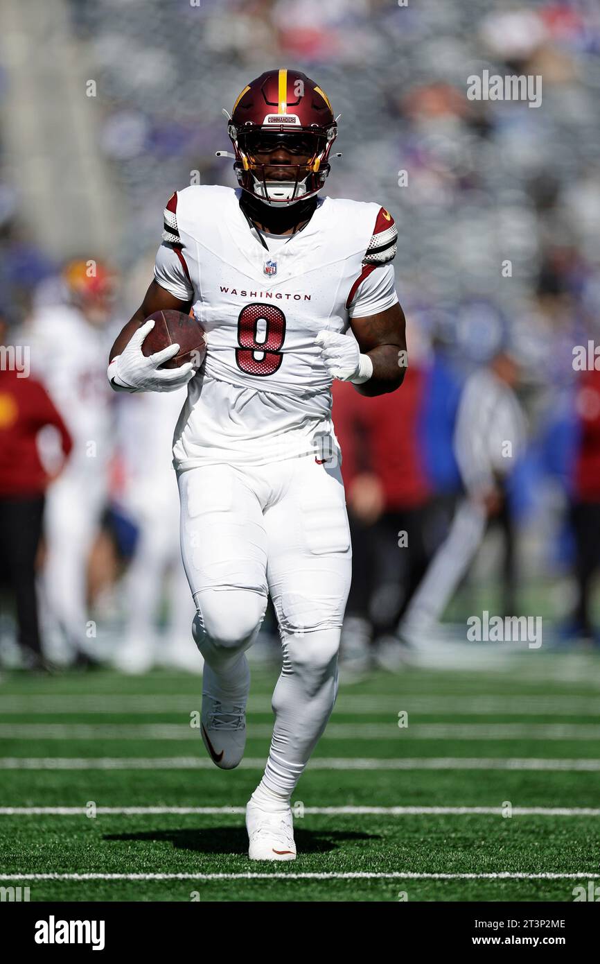 Washington Commanders running back Brian Robinson Jr. (8) warms up ...