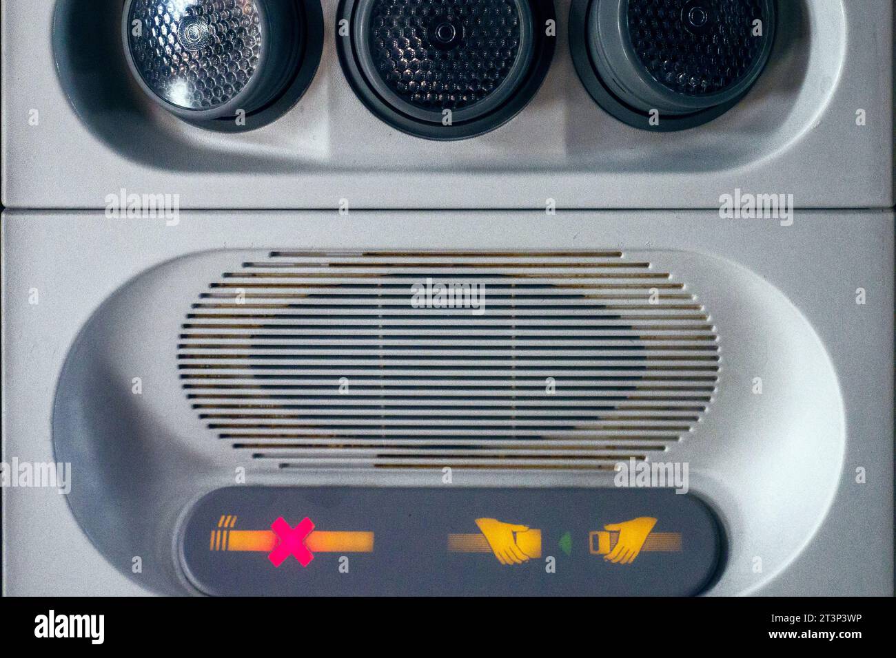 Information signs: no smoking and fasten your seat belts on plane ...