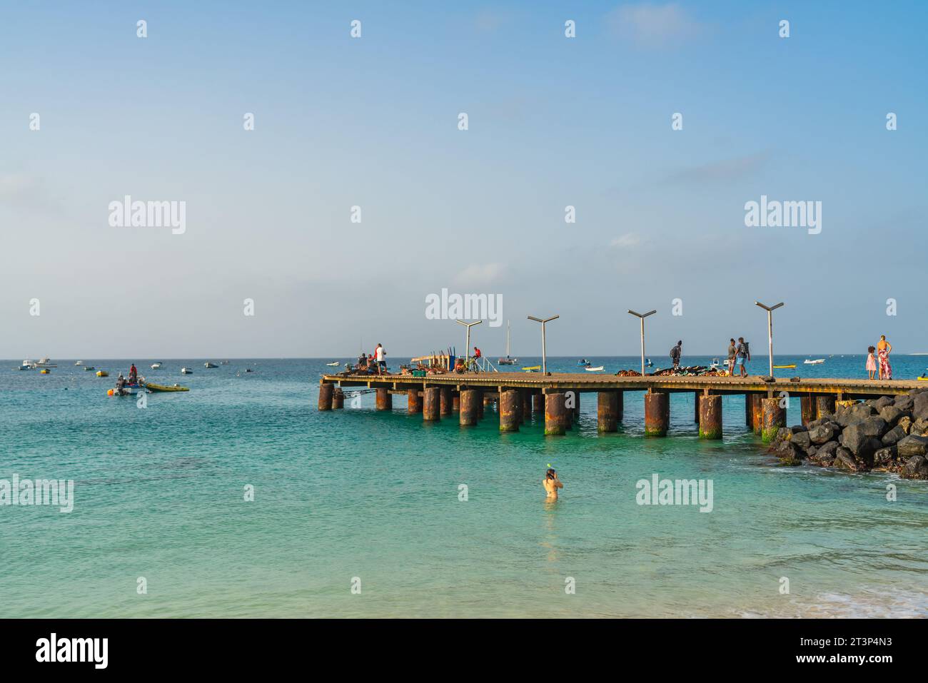 The pier of Santa Maria om Sal island in Cape Verde with people ...