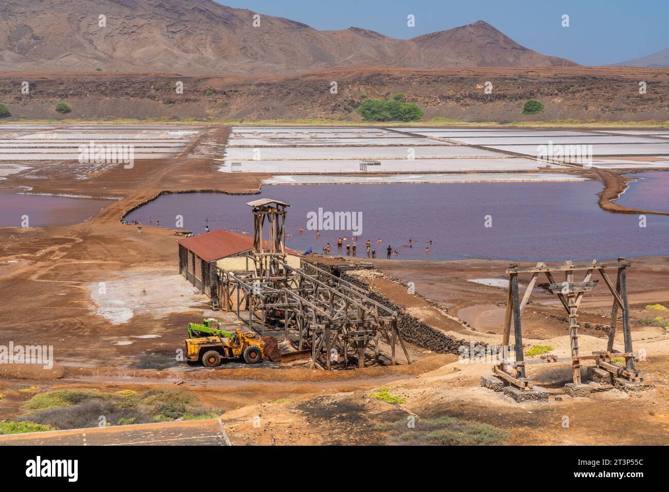 Building at the Salinas de Pedra de Lume, old salt lakes with people ...