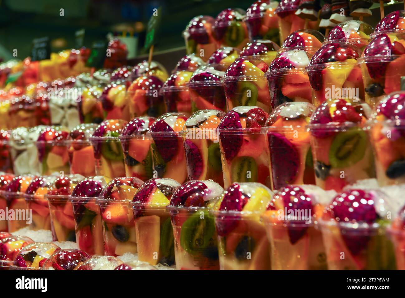 Display of fresh fruit cups at indoor market in Barcelona, - Barcelona ...