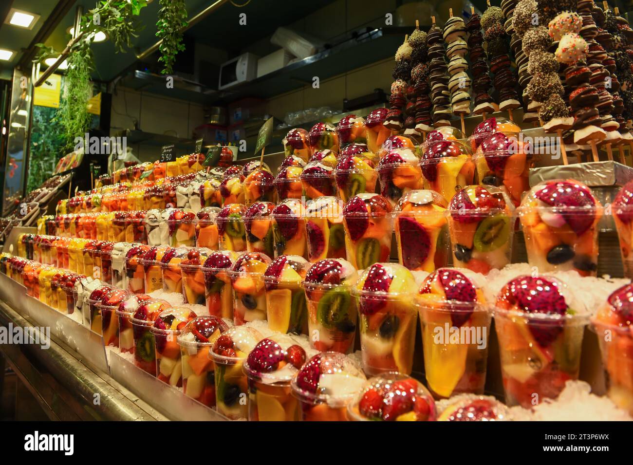 Display of fresh fruit cups at indoor market in Barcelona, - Barcelona Spain 31 July 2023 Stock ...