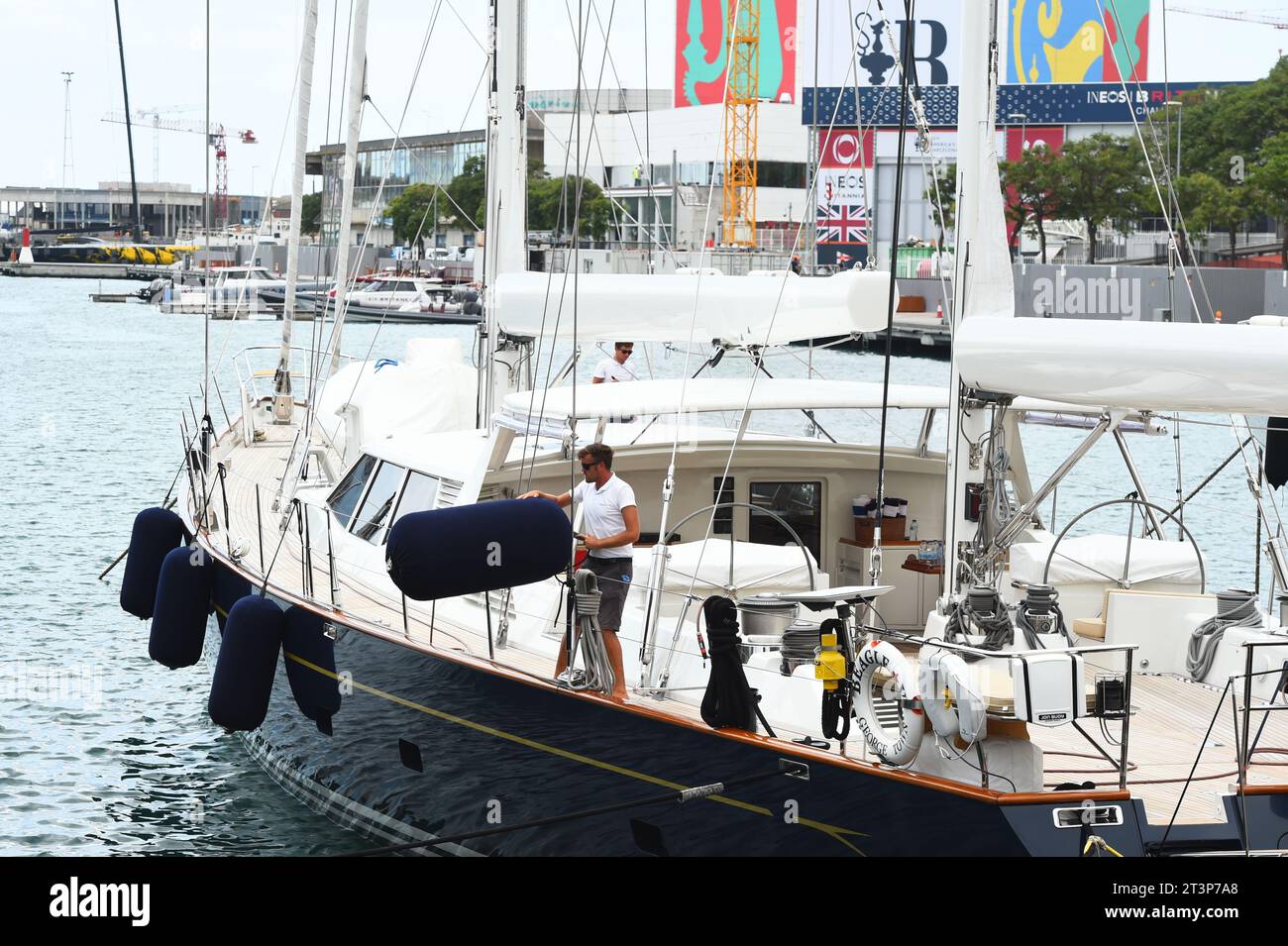 Deck crew working on super yacht in preparation for guests - Barcelona ...