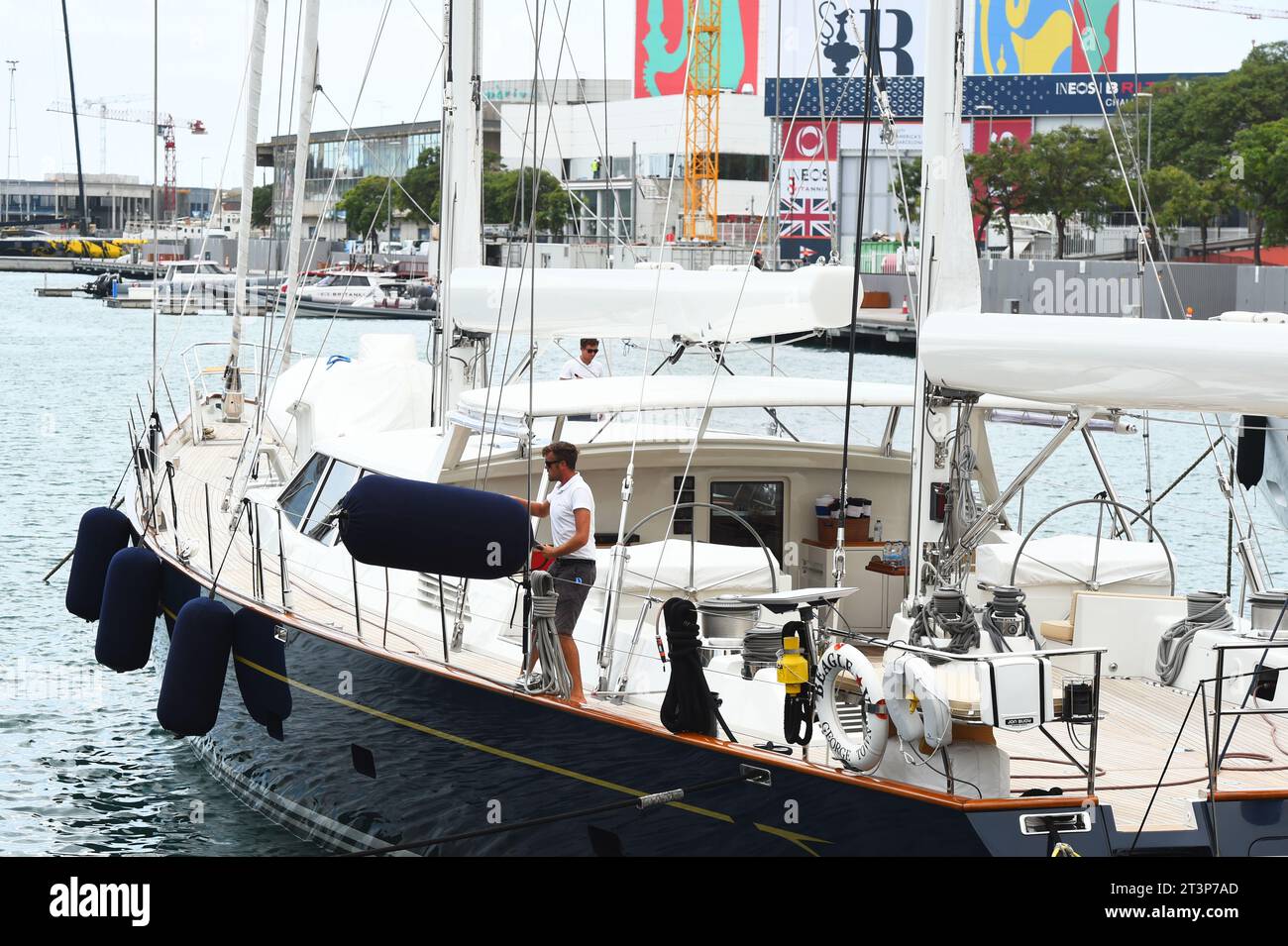 Deck crew working on super yacht in preparation for guests - Barcelona ...