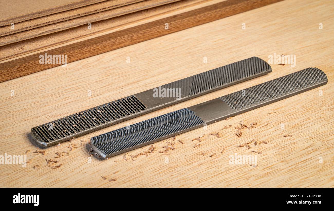 wood rasp files against okoume plywood - woodworking concept Stock ...