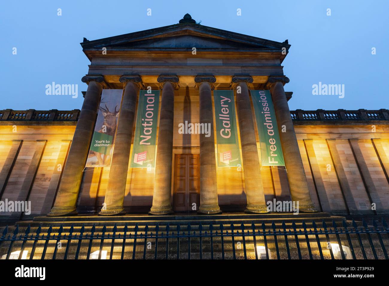 Evening view of floodlit Scottish National Gallery on The Mound in ...