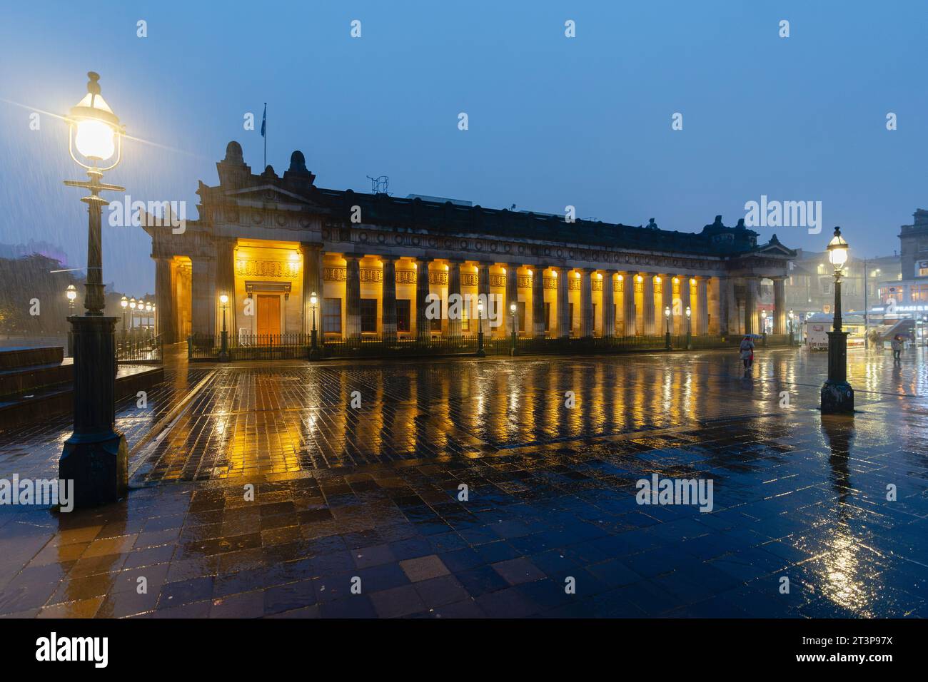 Evening view of floodlit Royal Scottish Academy art museum in the rain ...