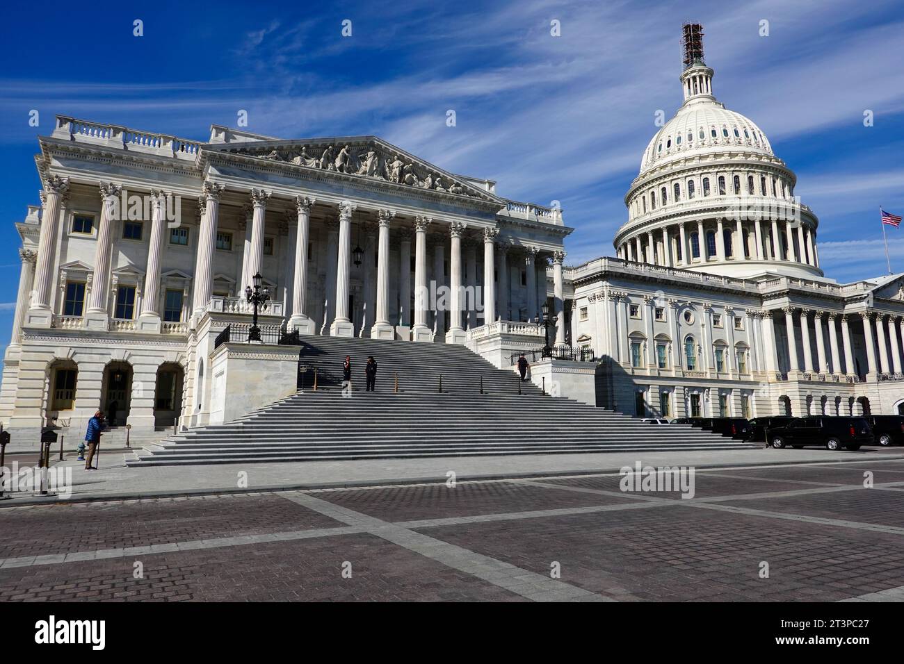 Police officers and lone photographer outside the US Capitol building ...