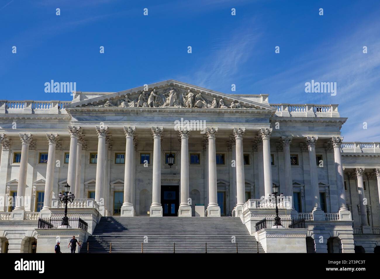 Two police officers on duty outside the US Capitol building steps ...
