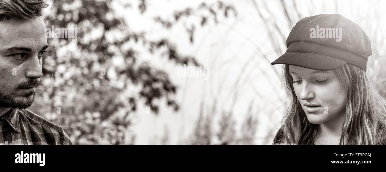 Horizontal banner or header with a young couple living a difficult ...