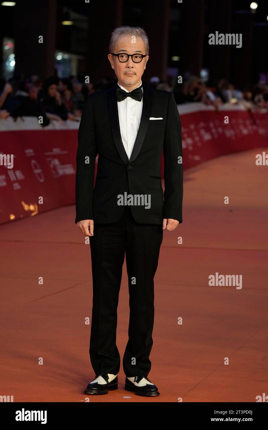 Actor Lily Franky poses on the red carpet for the film Cottontail at ...