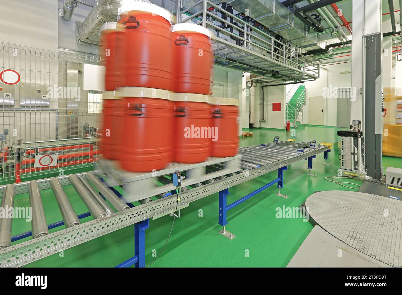 Plastic Barrels Moving at Automated Storage Gravity Conveyor in ...