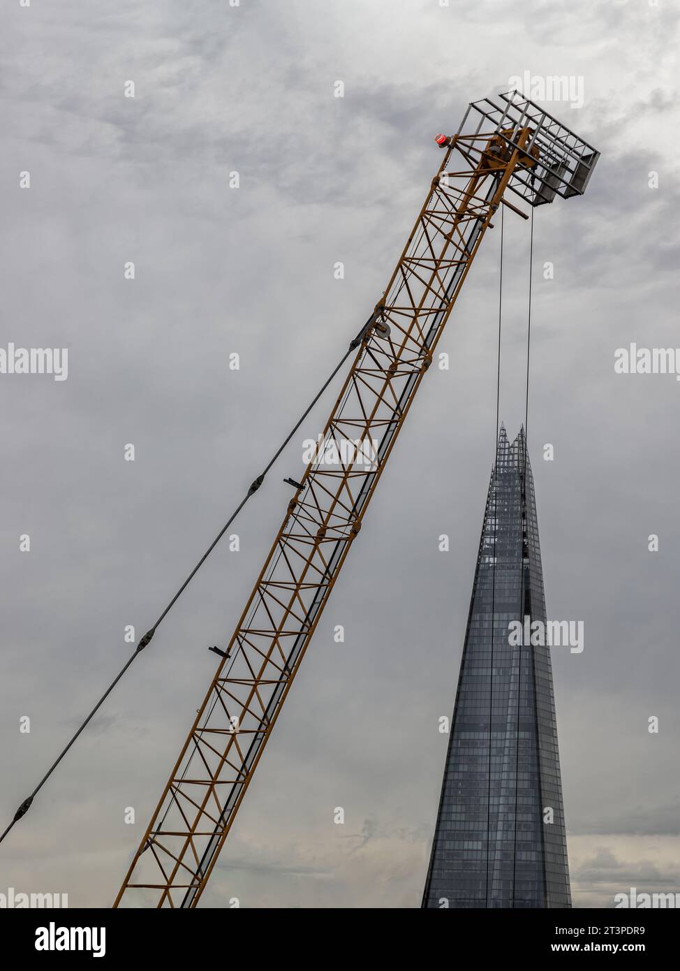 London, UK - Oct 23, 2023 - The Construction crane is overlapped with ...