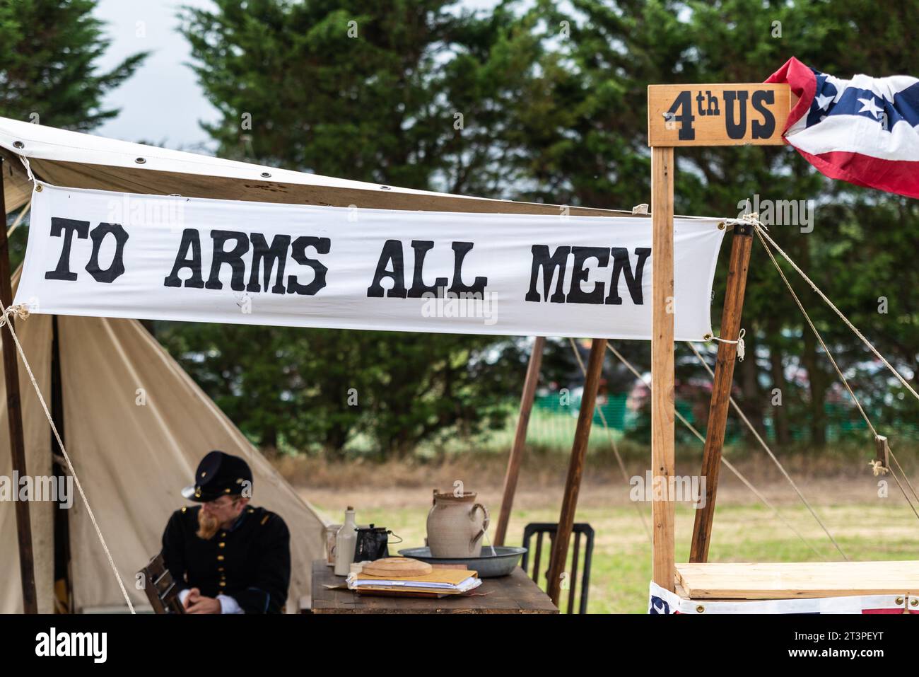 To arms all men, sign above a re-enactment of an American Civil War ...